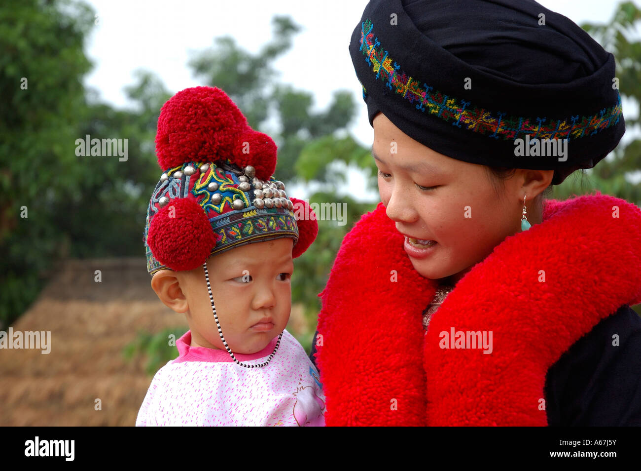 Portrait of young Yao (Mien) Indigenous mother in her traditional ...