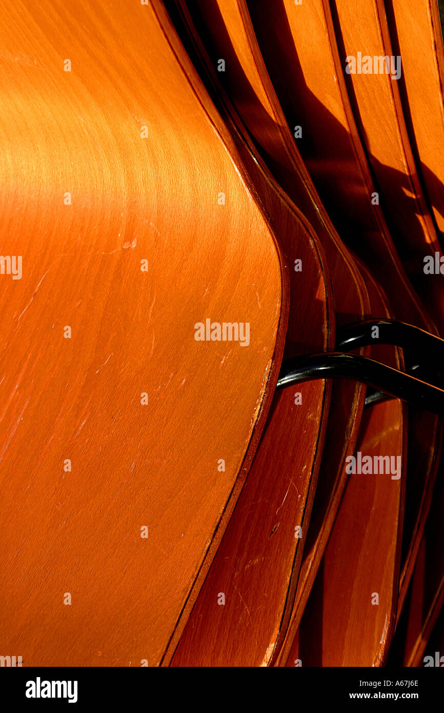 detail from rack of wooden school type chairs stuck together Stock ...