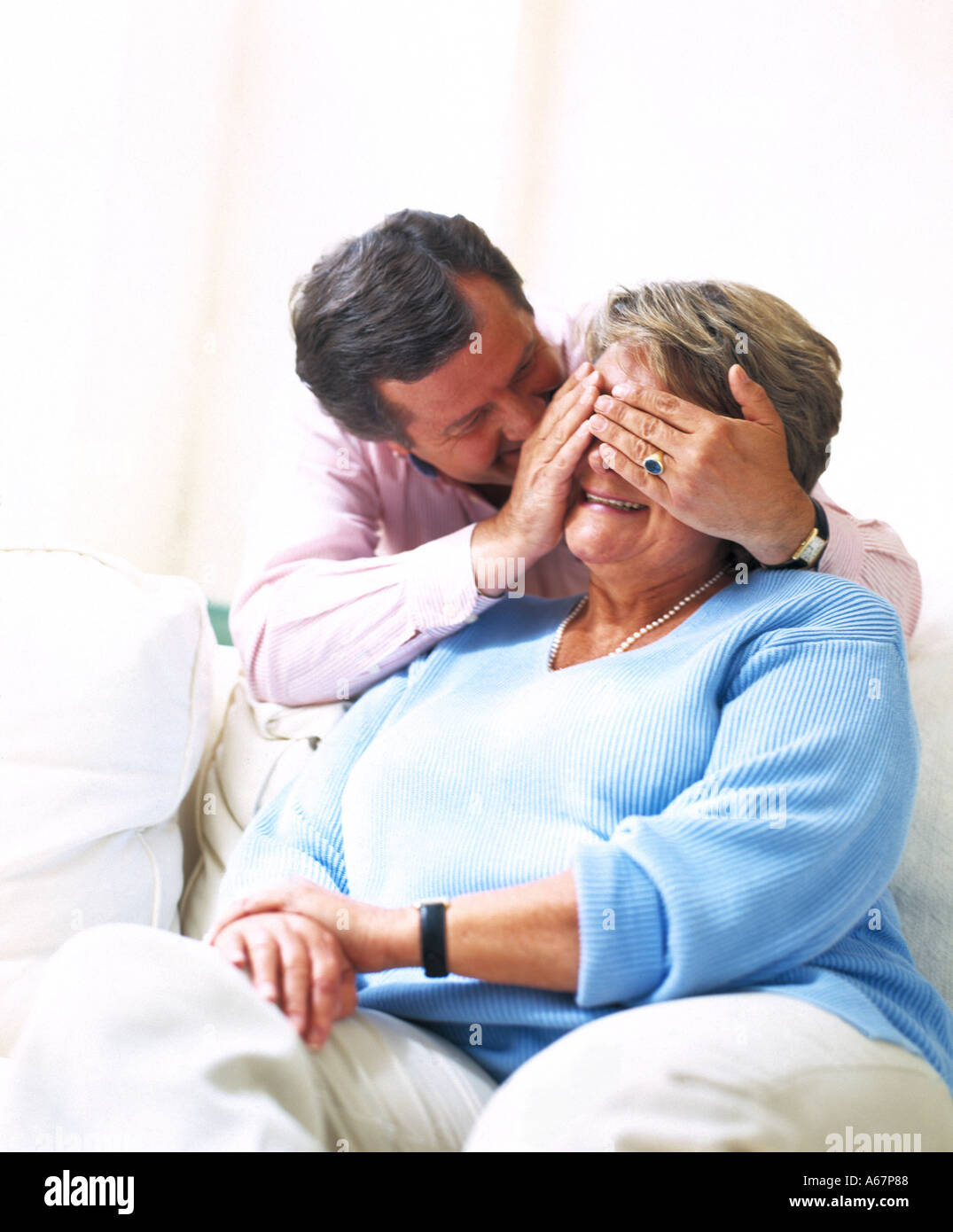 Middle aged couple embrace interior hi-res stock photography and images ...