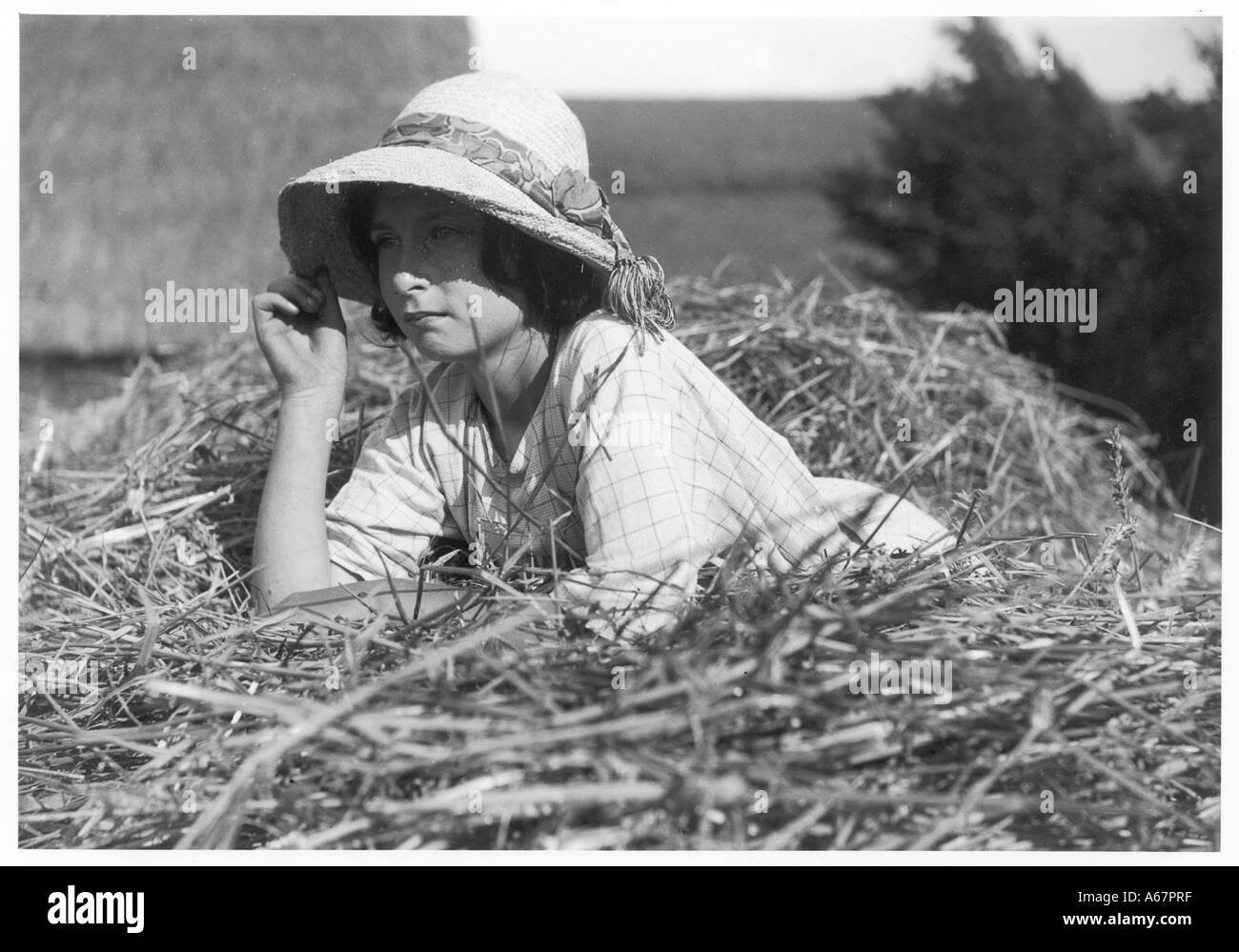 Girl lying on haystack hi-res stock photography and images - Alamy