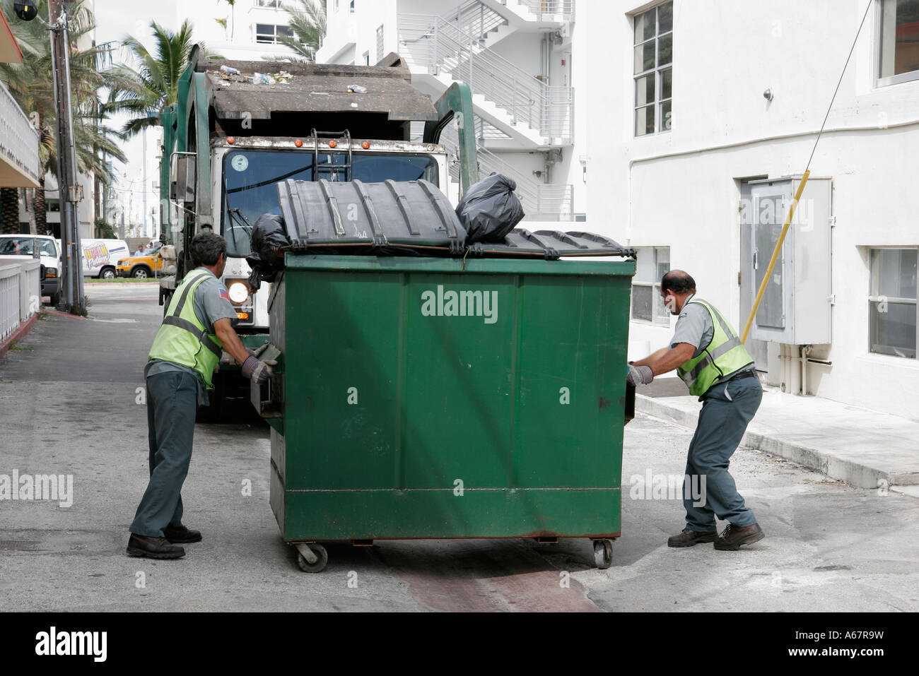 Miami Beach Florida,garbage collectors,truck,lorry,bin,alley,manual ...