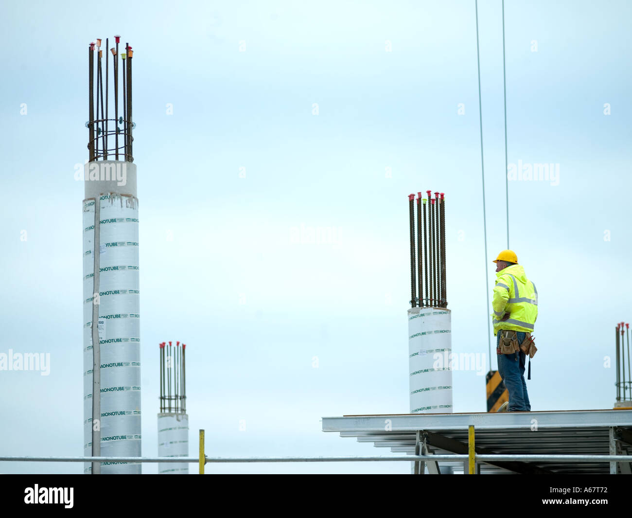 bulider standing on top of building wearing construction clothes Stock ...