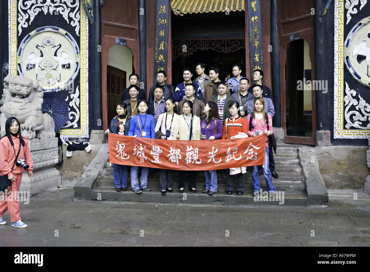 CHINA FENGDU Chinese tour group poses for group photo in front of the ...