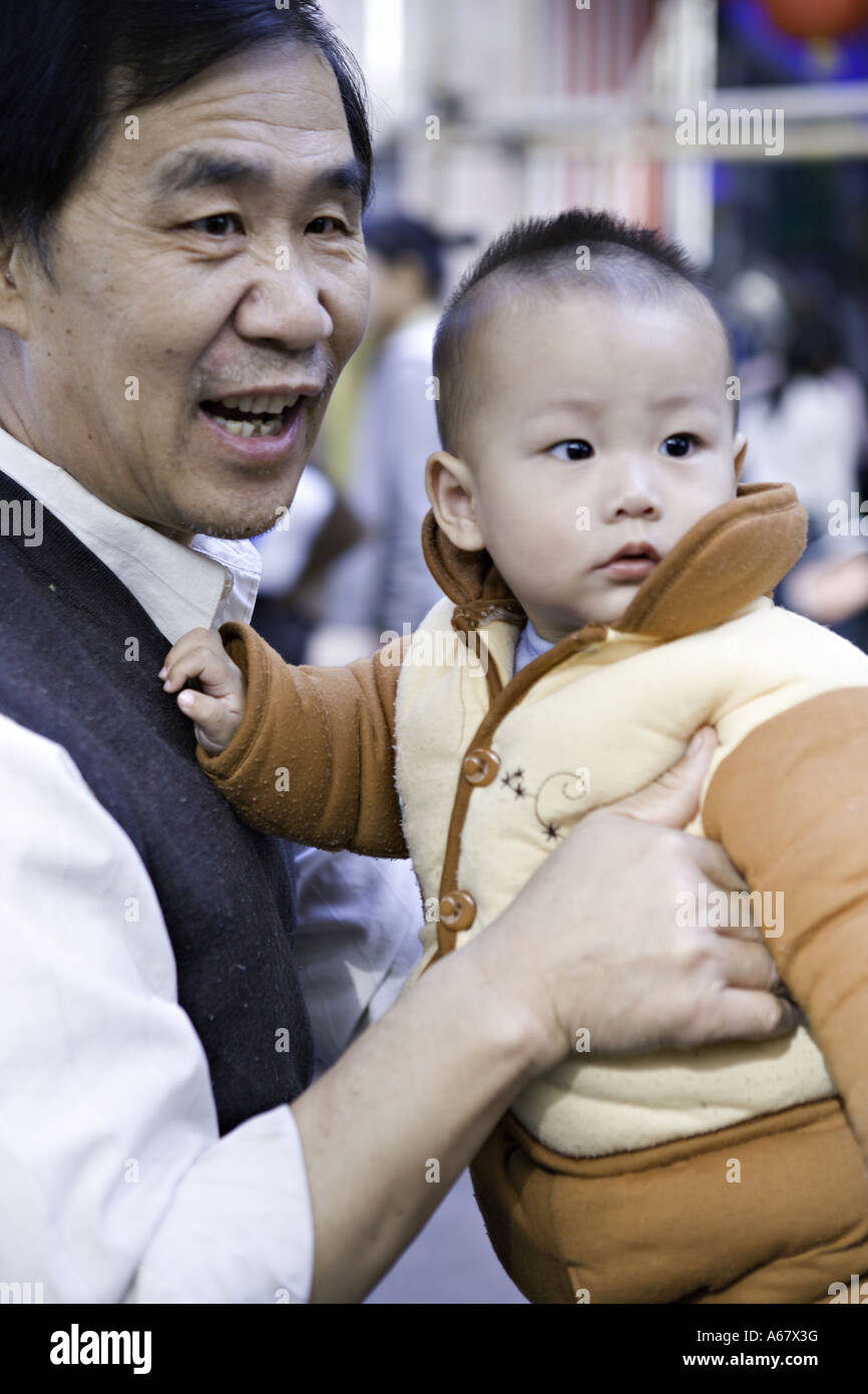 CHINA WUHAN Proud Chinese grandfather plays with his baby grandson on a ...
