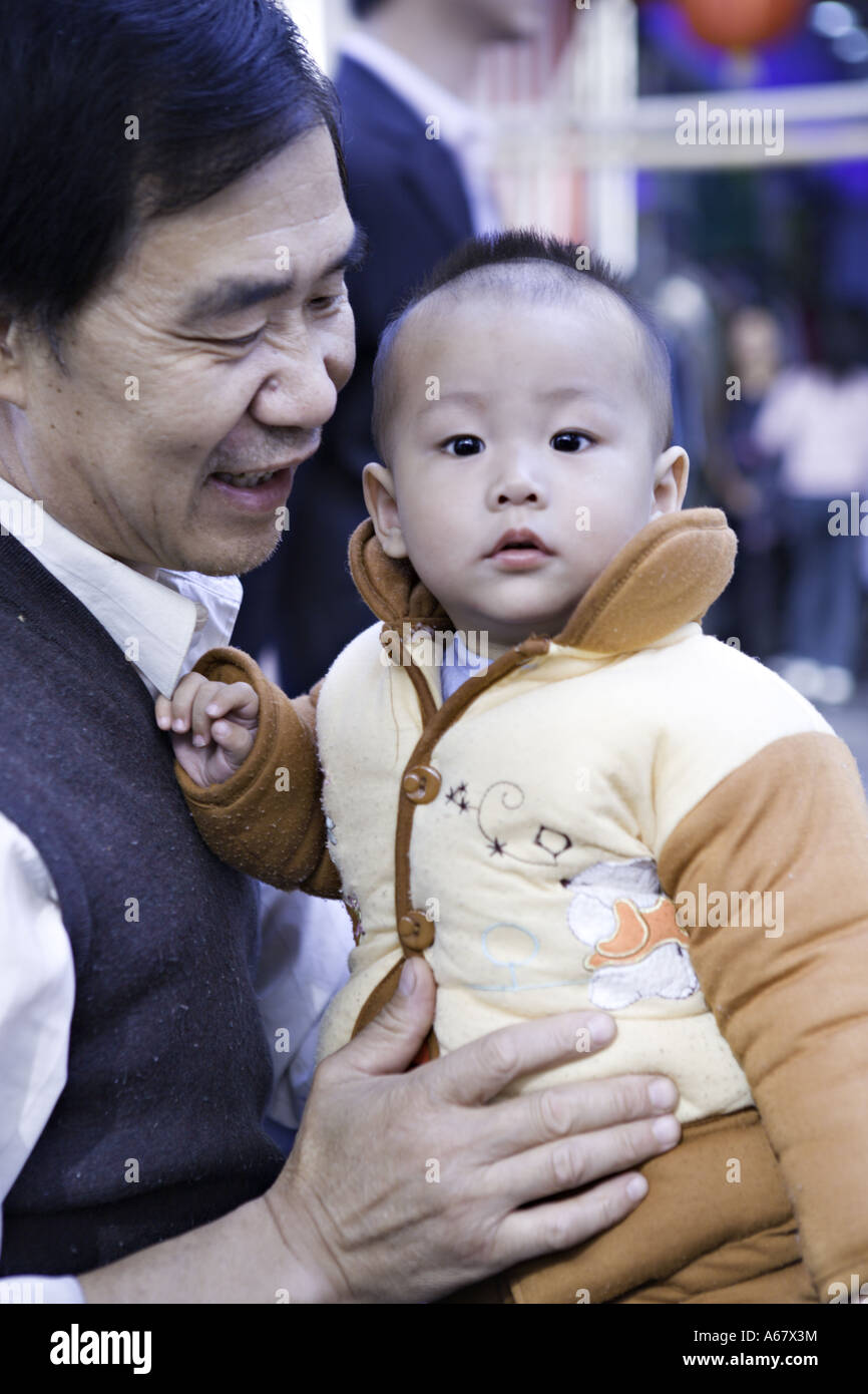 Chinese grandfather looking grandson hi-res stock photography and ...