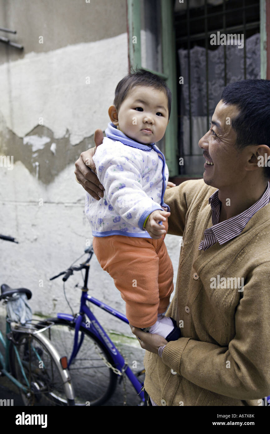 CHINA SHANGHAI Proud young Chinese father shows off his baby son on a ...