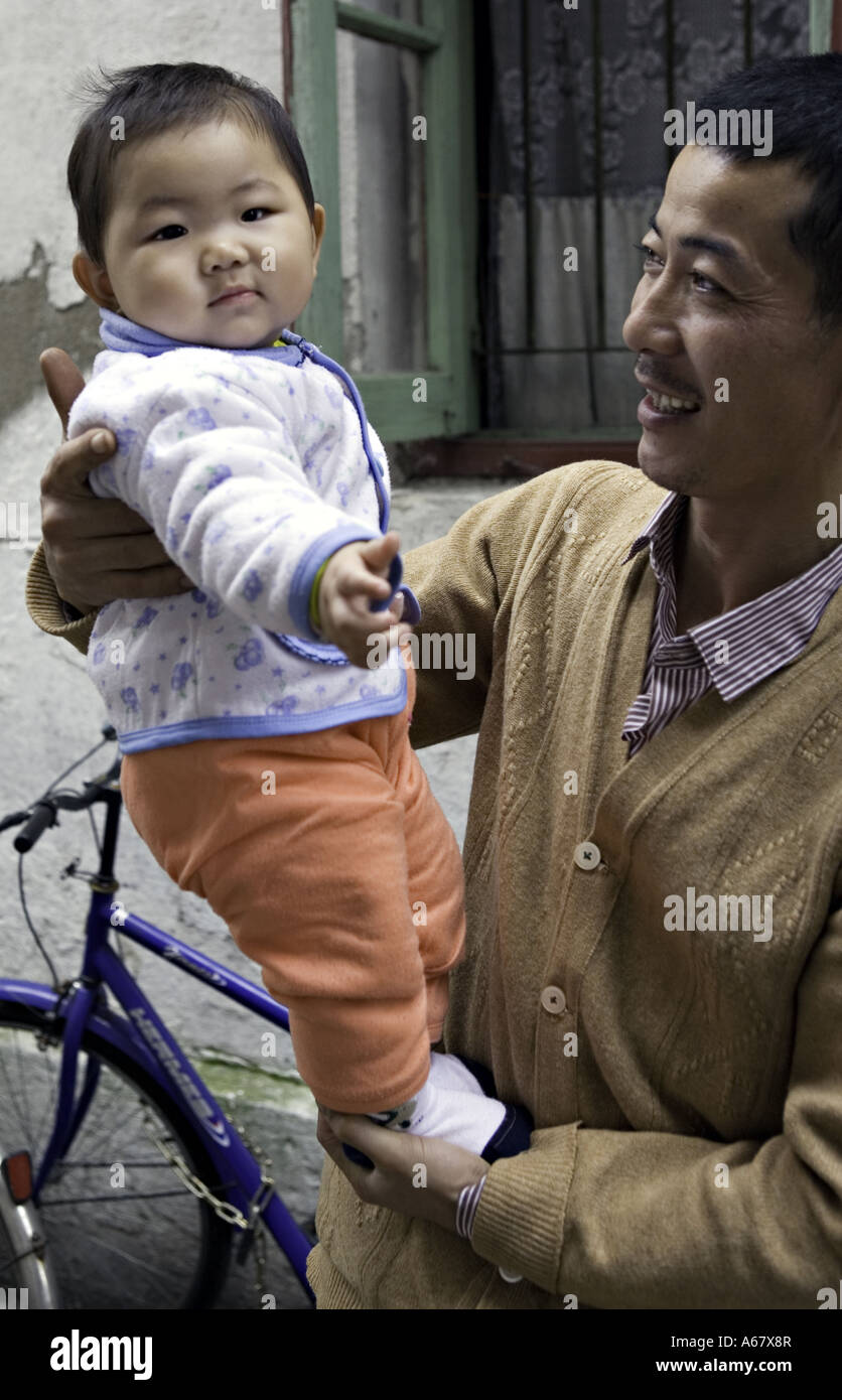 CHINA SHANGHAI Proud young Chinese father shows off his baby son on a ...