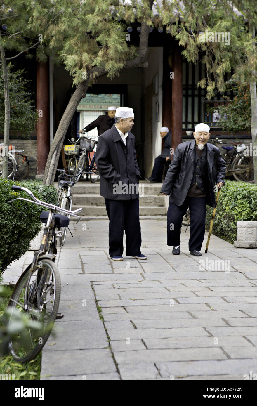 CHINA XIAN Chinese Muslim men talk in the beautiful gardens of the ...