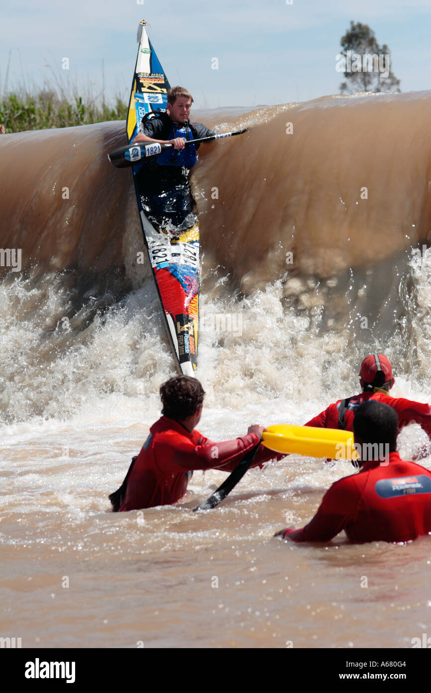 Kayak racers go over weir during river race in Cradock South Africa ...