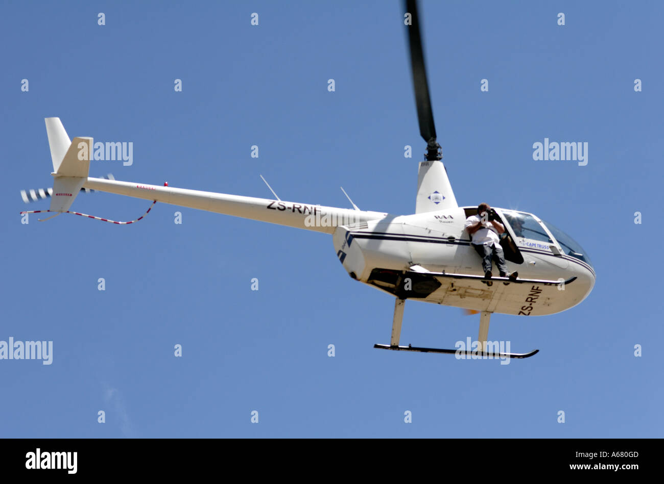 Man filming from helicopter Stock Photo - Alamy