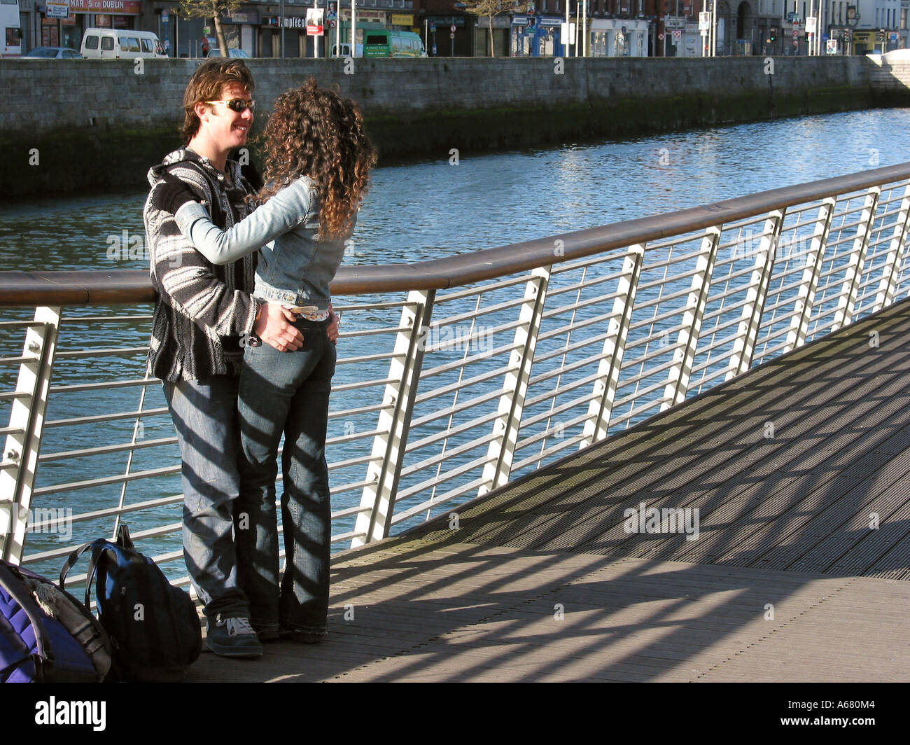 young couple cuddling on Bachelors Walk Dublin Ireland Stock Photo - Alamy