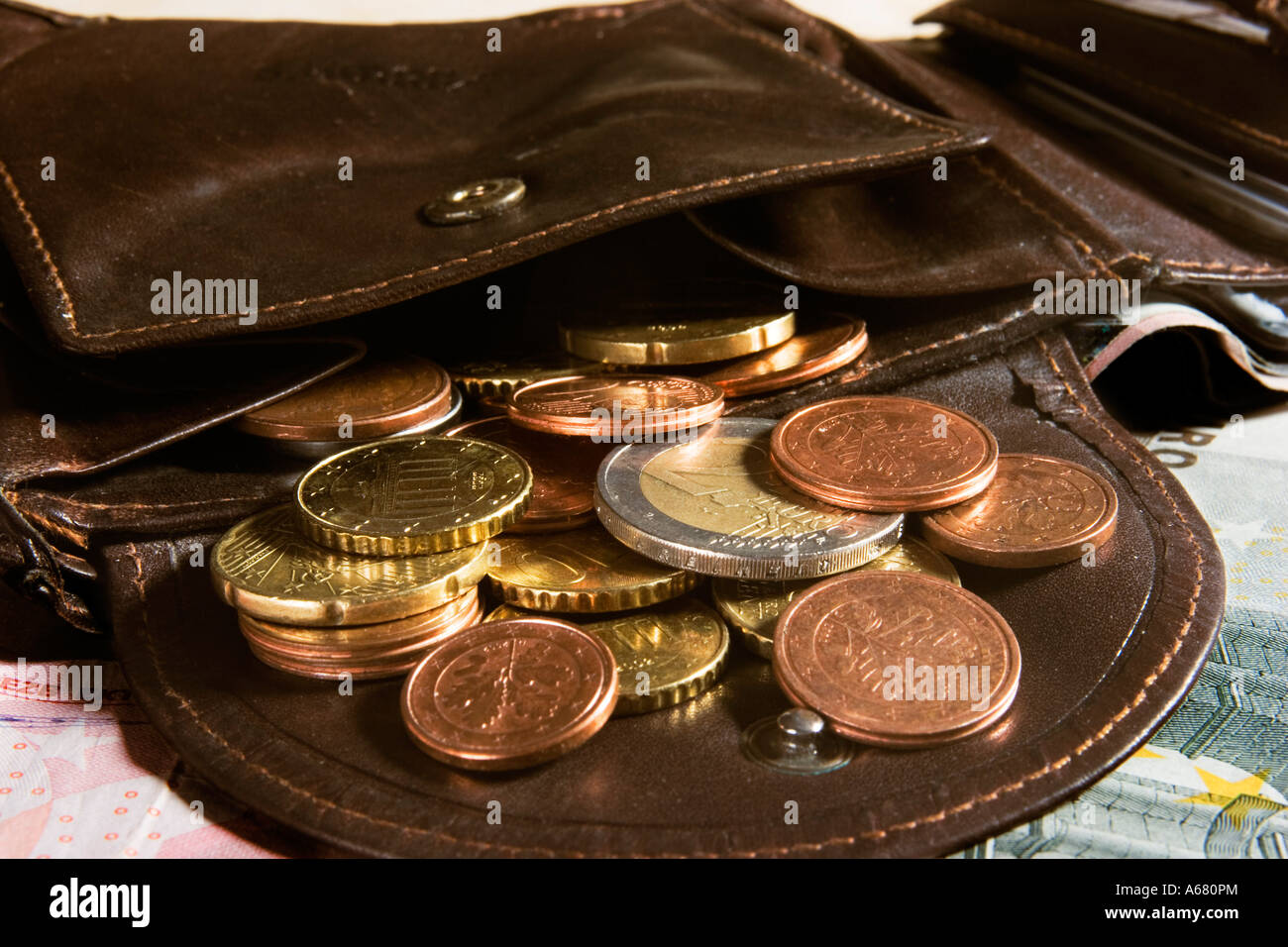 Coins and wallet Stock Photo - Alamy