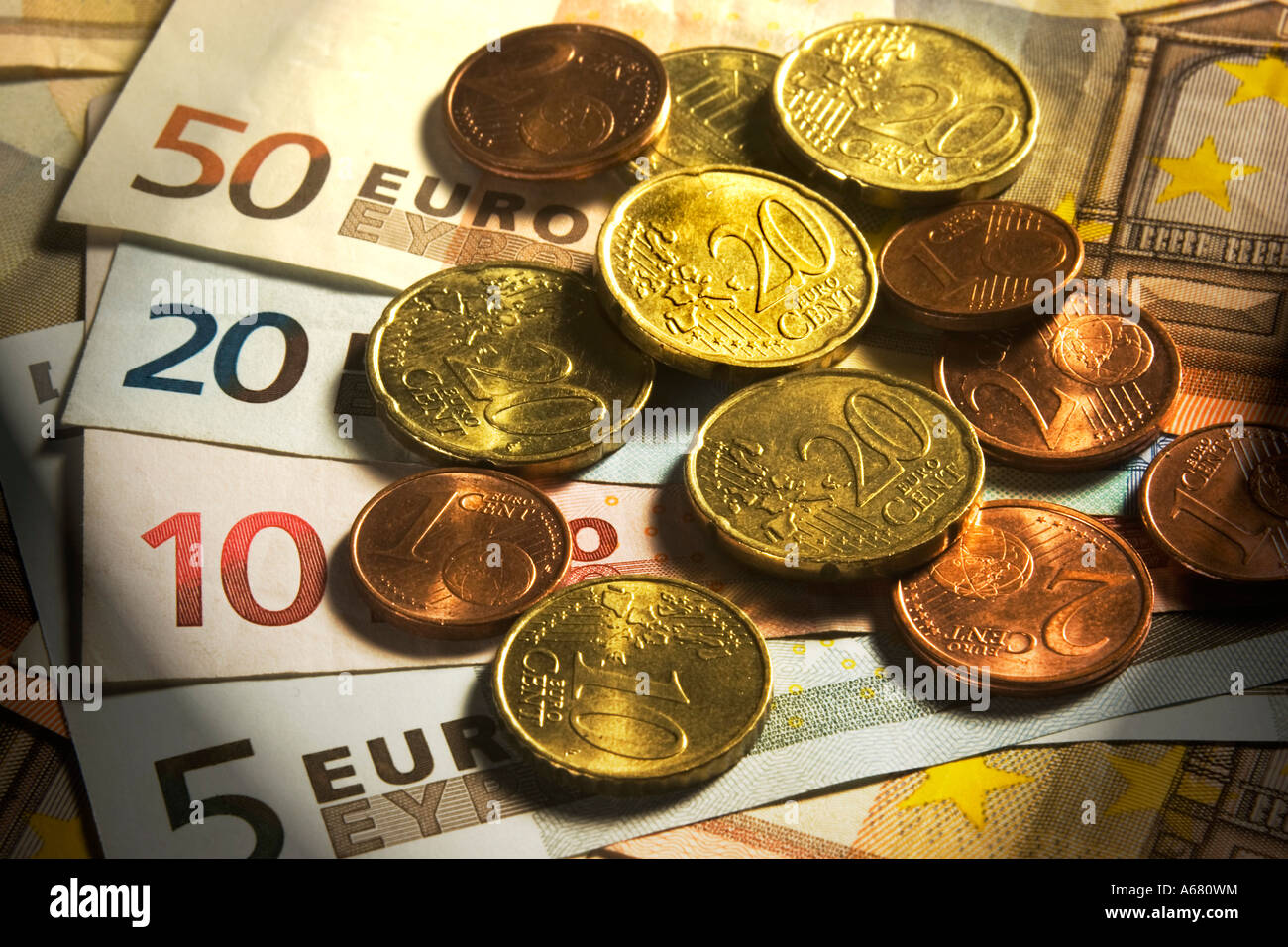 Euro notes and coins Stock Photo - Alamy