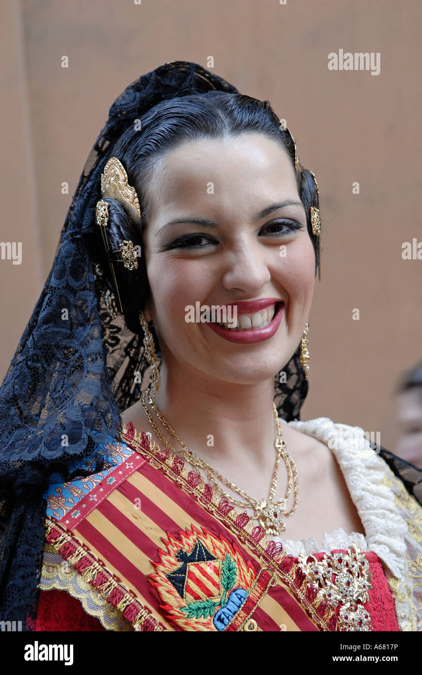 Spanish woman with elaborate spiralled buns on the side of her head, a ...