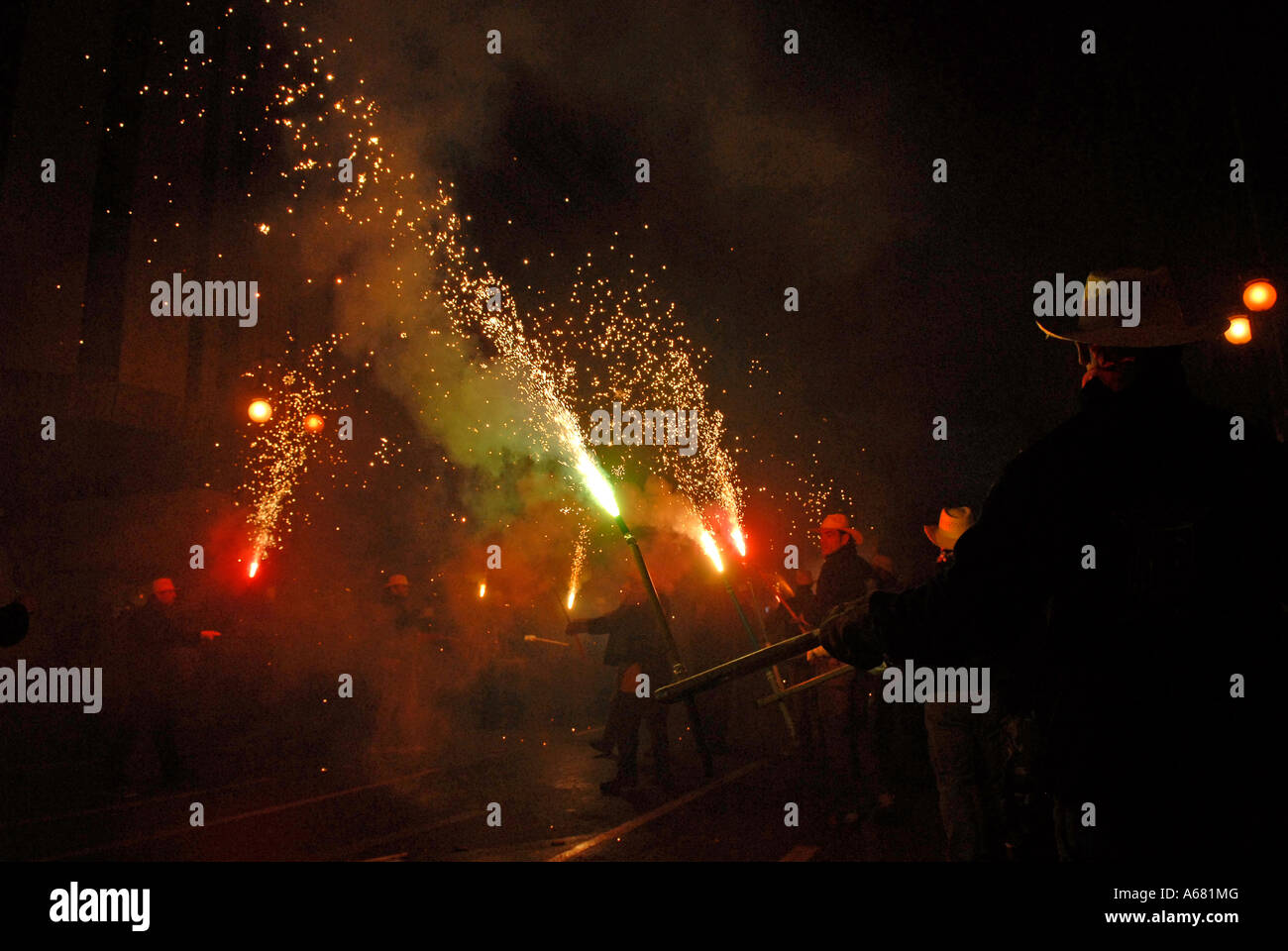 Fallers marching in the street during Cavalcada del Foc the Fire Parade ...
