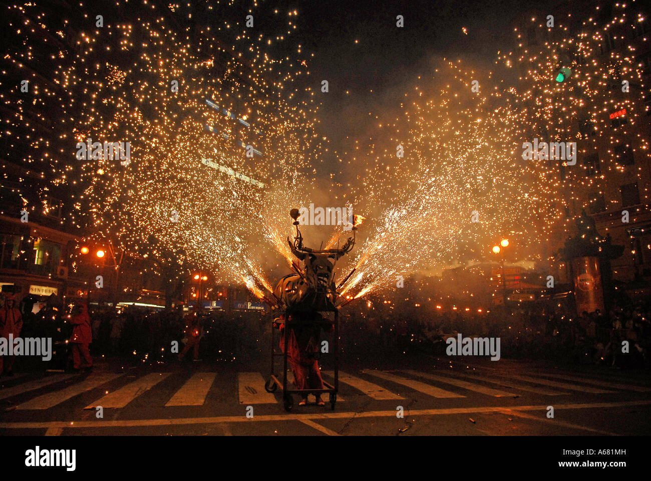 Fallers marching in the street during Cavalcada del Foc the Fire Parade ...