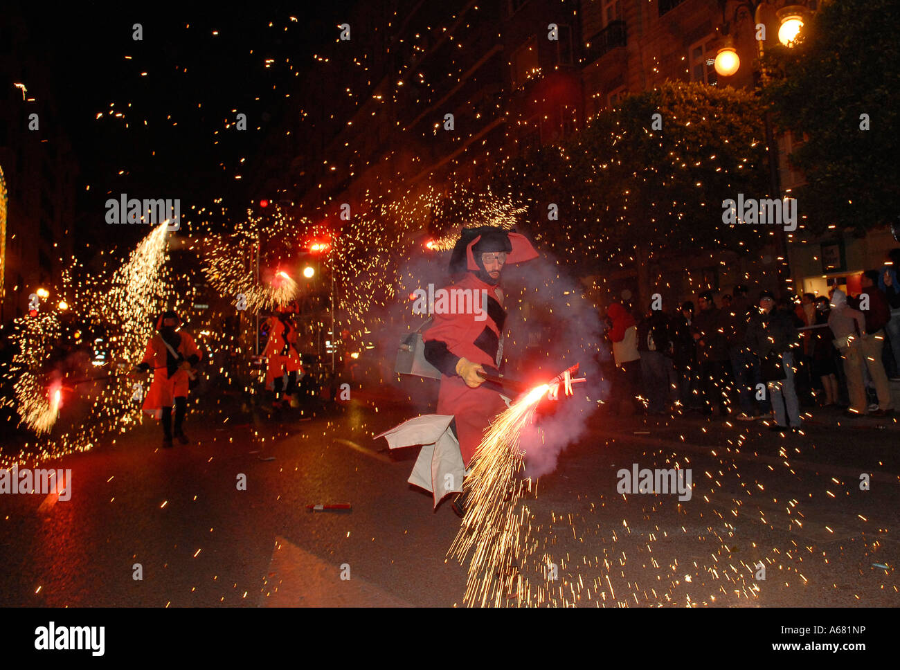 Fallers marching in the street during Cavalcada del Foc the Fire Parade ...