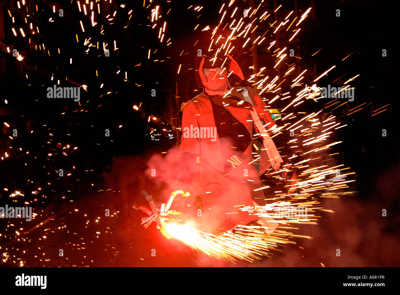 Fallers marching in the street during Cavalcada del Foc the Fire Parade ...