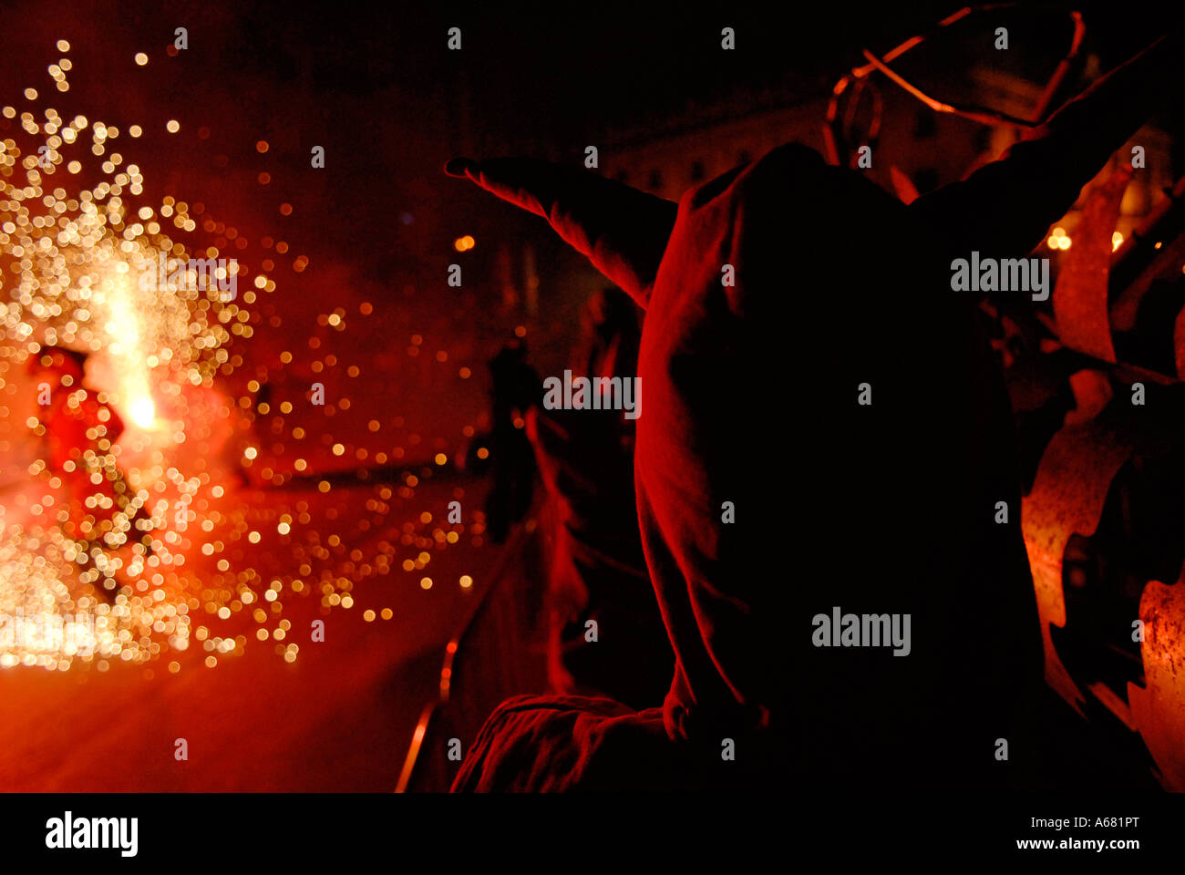 Fallers marching in the street during Cavalcada del Foc the Fire Parade ...