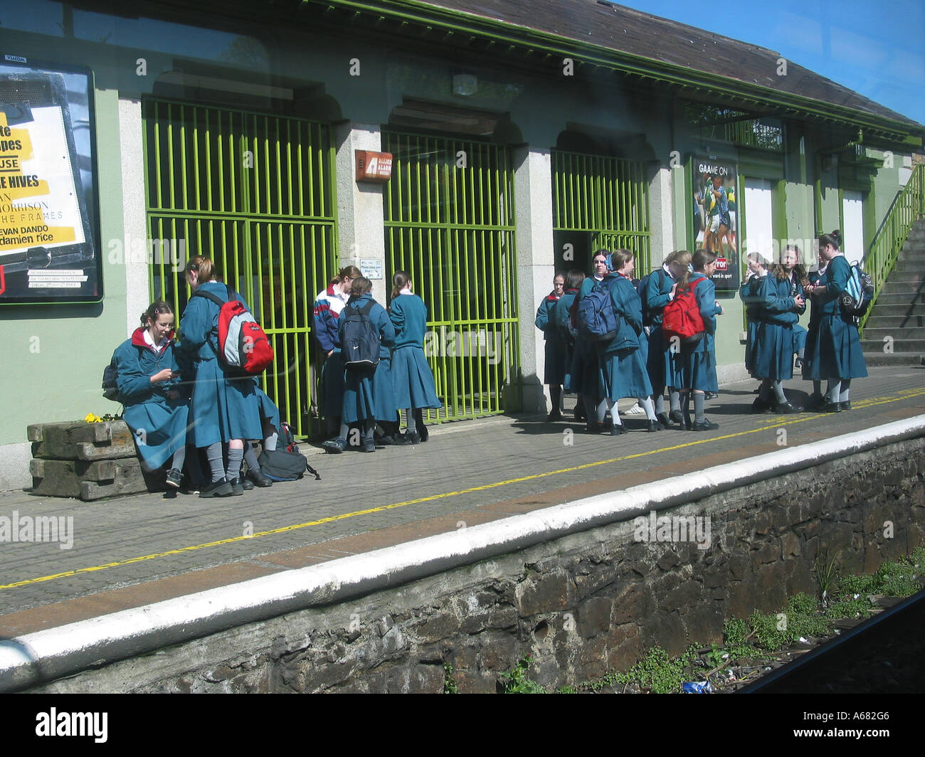 school kids in uniform waiting on platform at Dun Laoghaire train ...