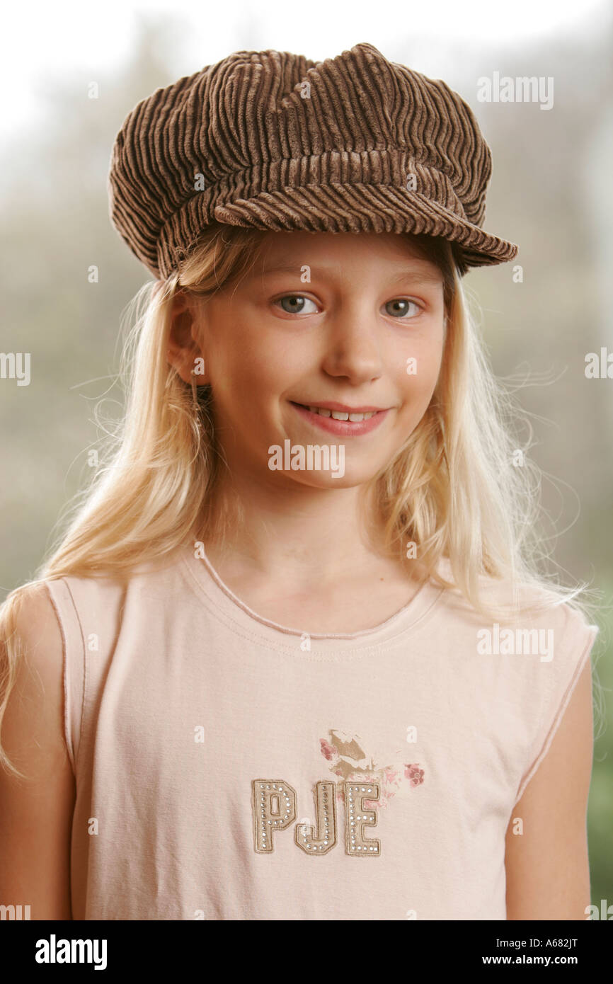 Young smiling girl with cap Stock Photo - Alamy