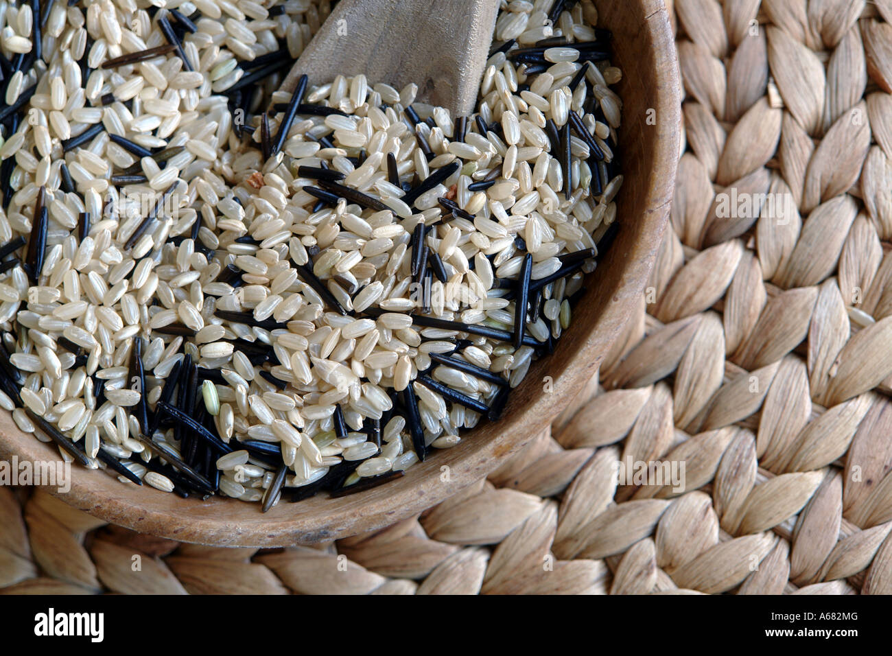 Rice mixture of long grain and wild grain rice in a wooden bowl Stock ...