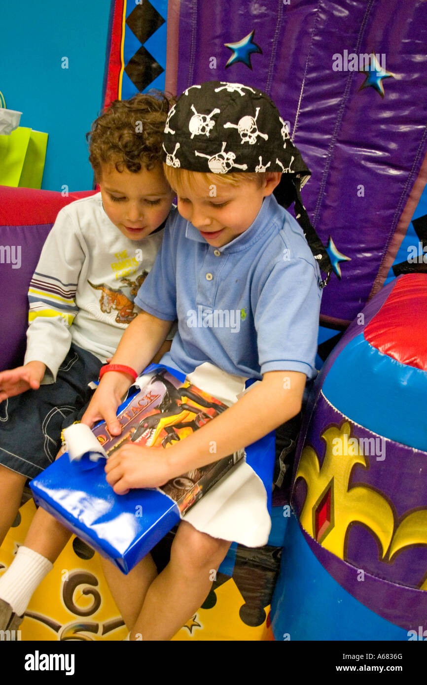 Unwrapping birthday gift at Pump It Up - The Inflatable Party Zone ...