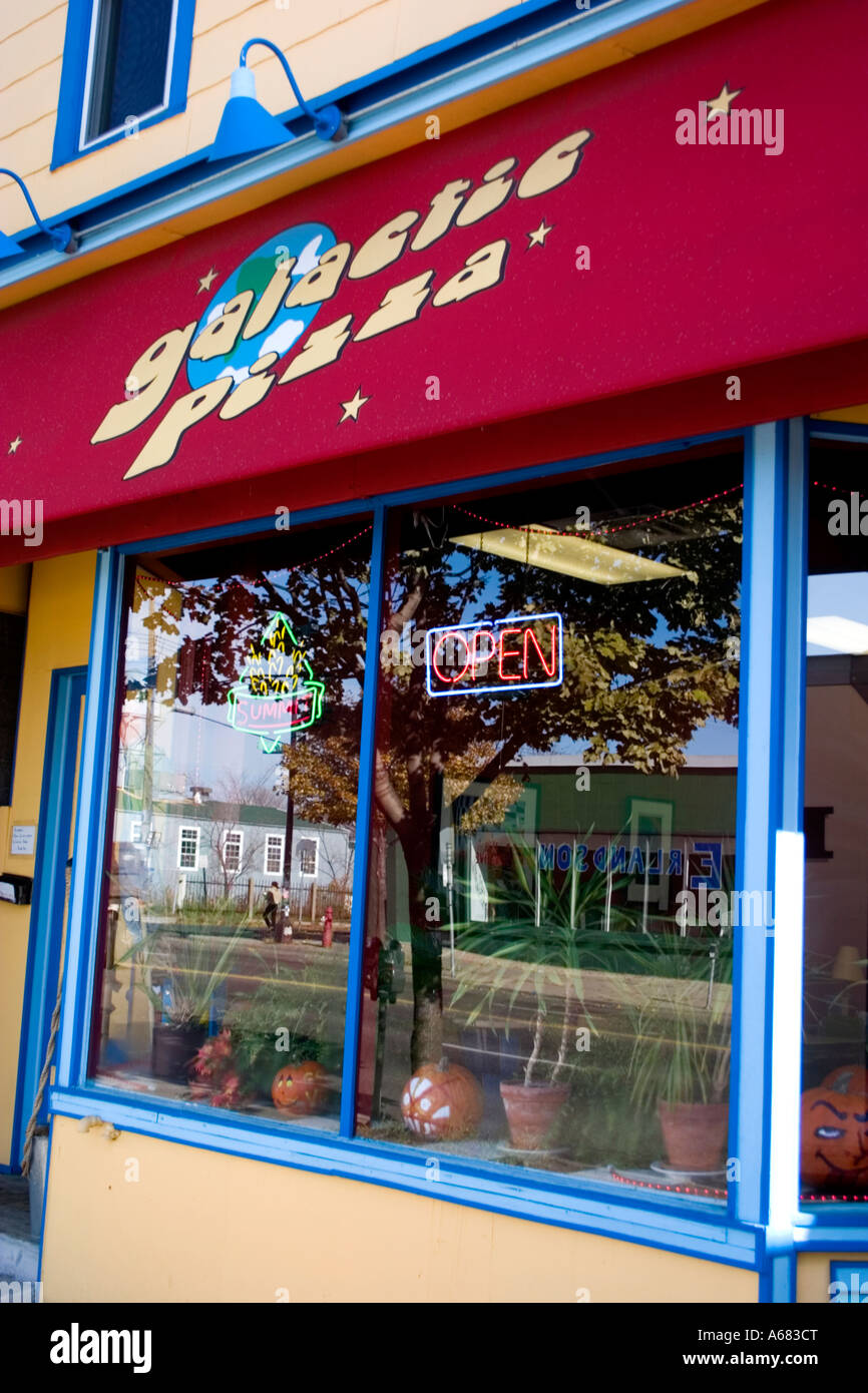 Storefront of Galactic Pizza where employees deliver in superhero or ...