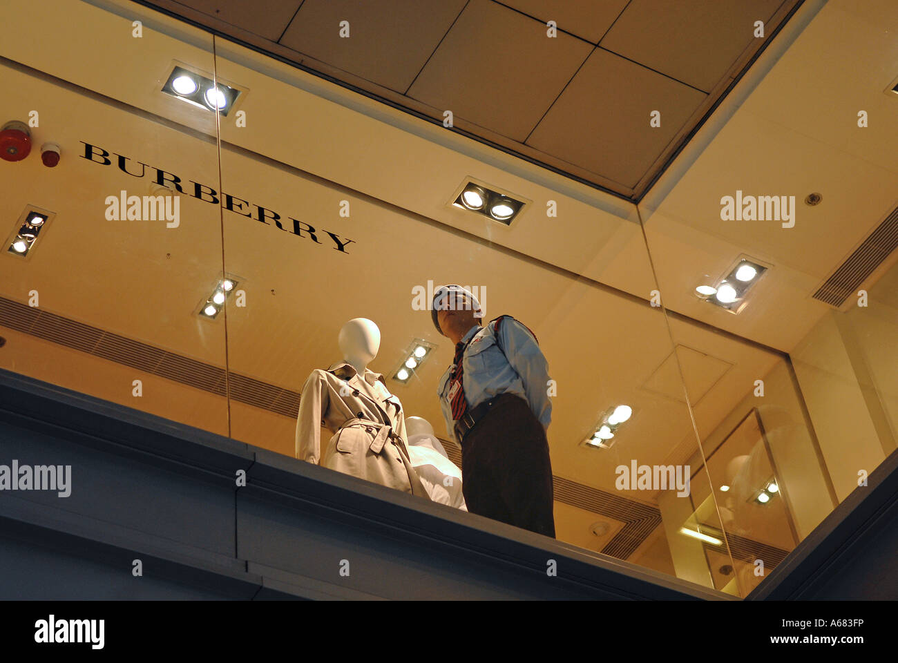 Guardian at a modern department store Hong Kong China Stock Photo - Alamy