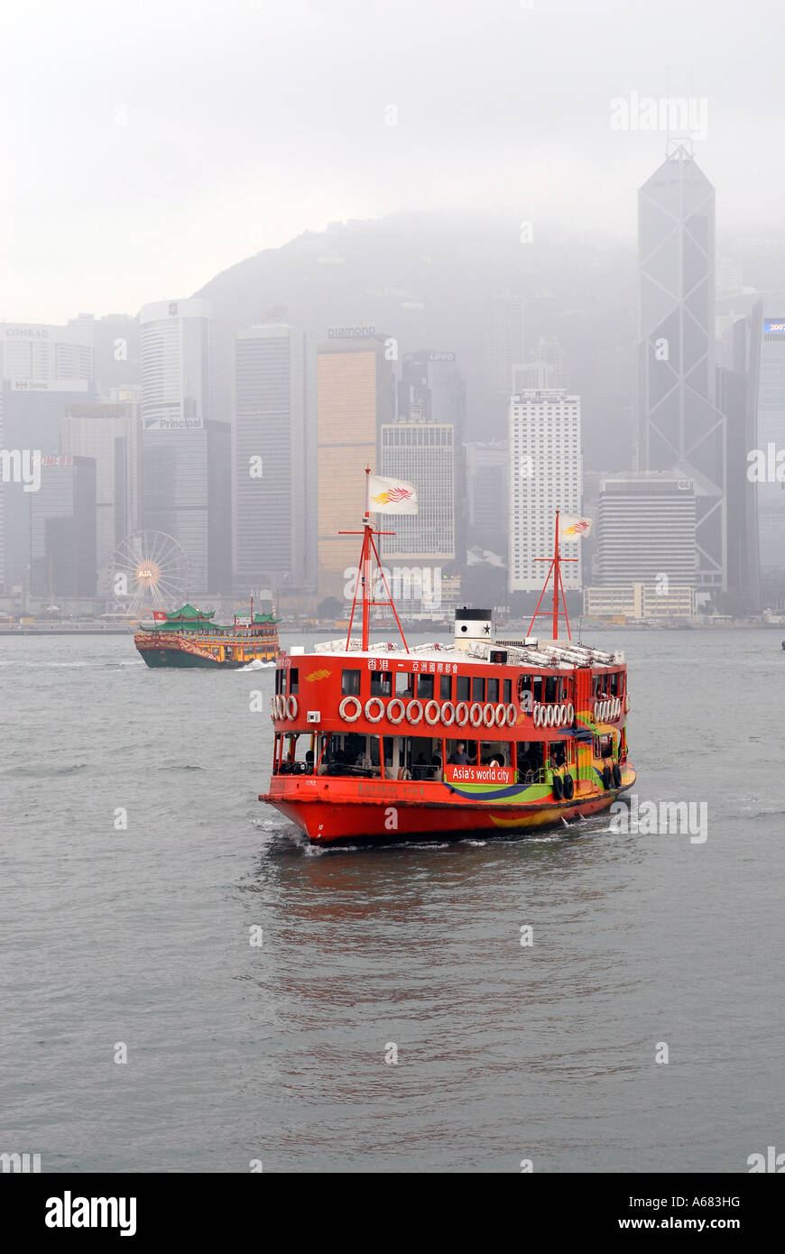 A Star Ferry in Asia's World City livery carries passengers across ...