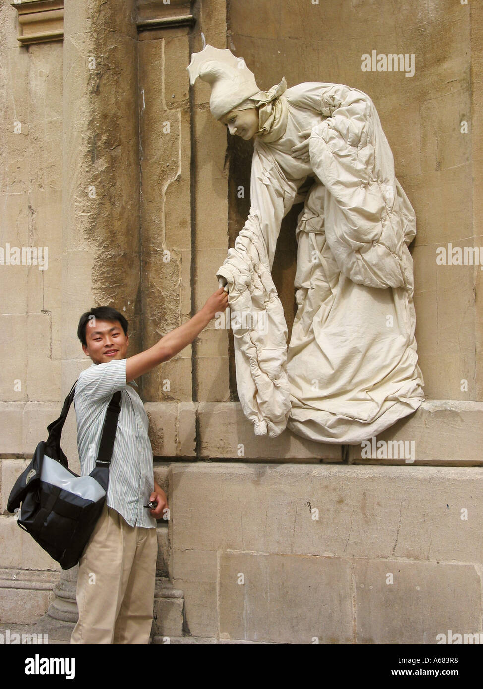living statue shaking hands with member of the public High Street Bath ...