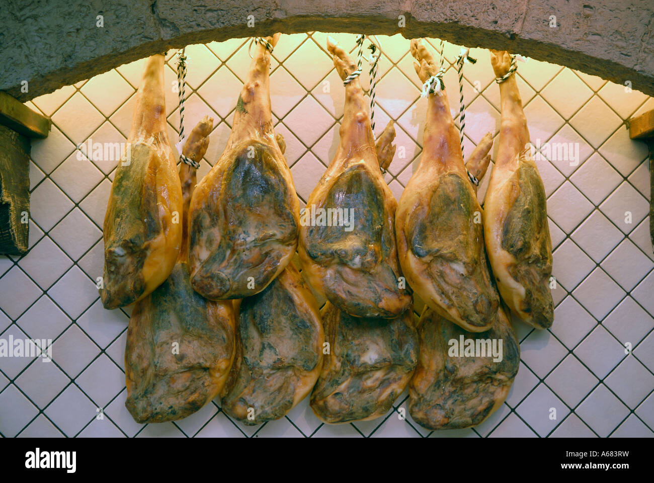 Stack of Jamon Serrano hams hanging at La Boqueria fruit market in ...