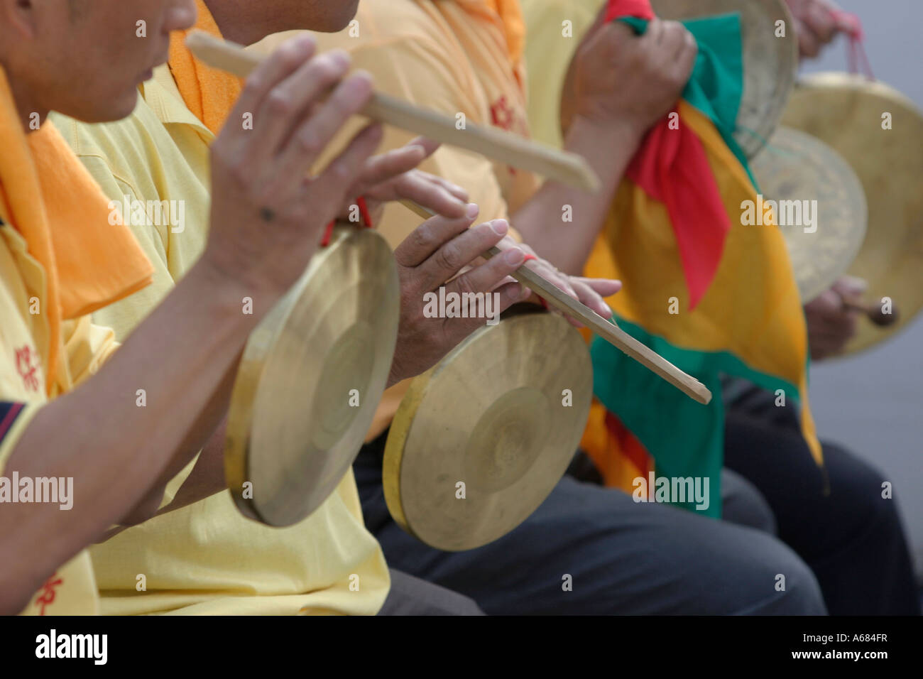 Asian people play cymbals together for fun Stock Photo - Alamy