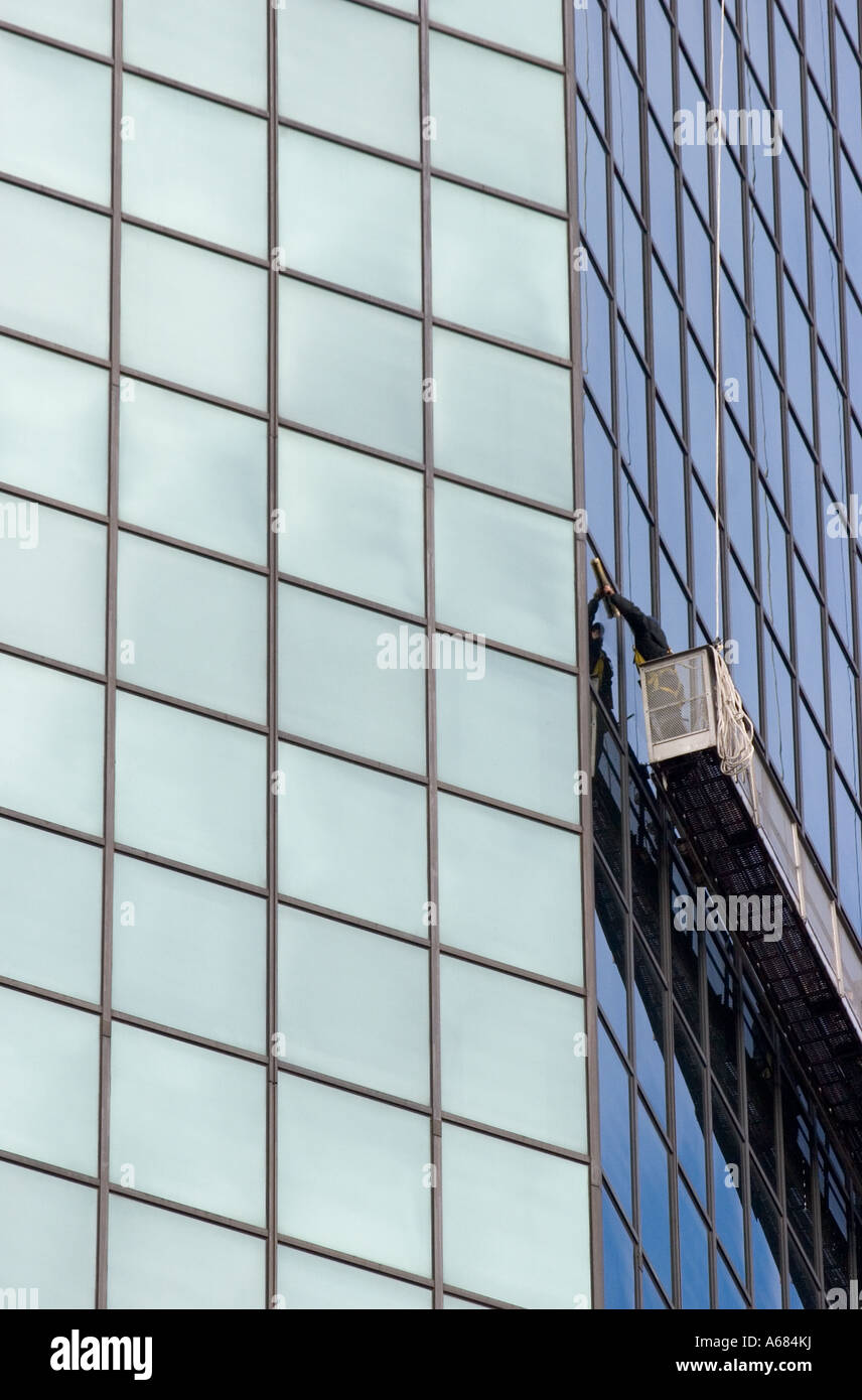 Crop of man cleaning window on Skyscraper Manhattan NY Stock Photo - Alamy