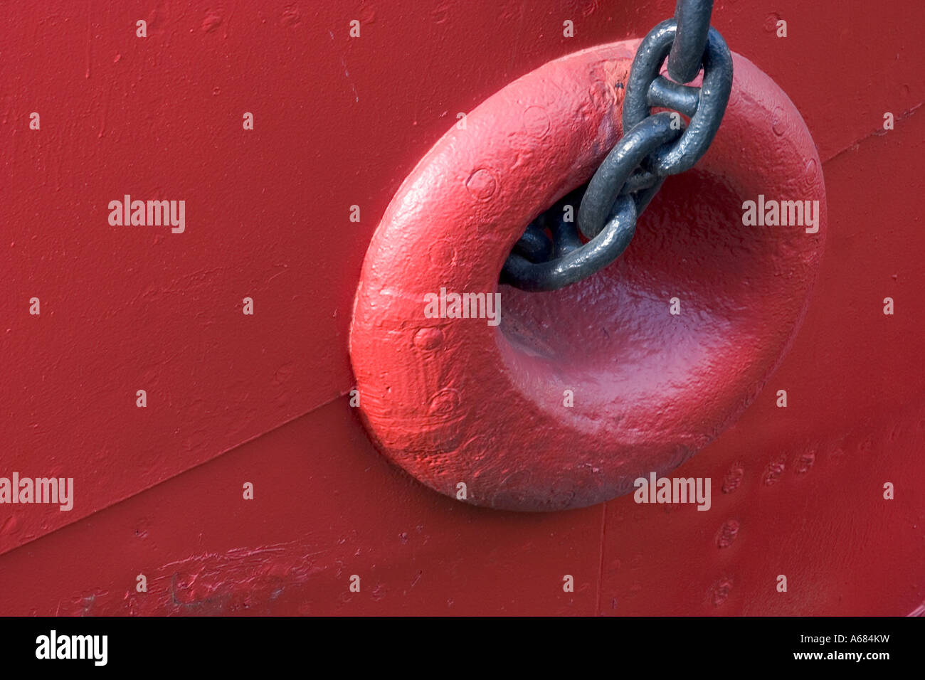 Close up of red hull and anchor chain on ship Stock Photo - Alamy