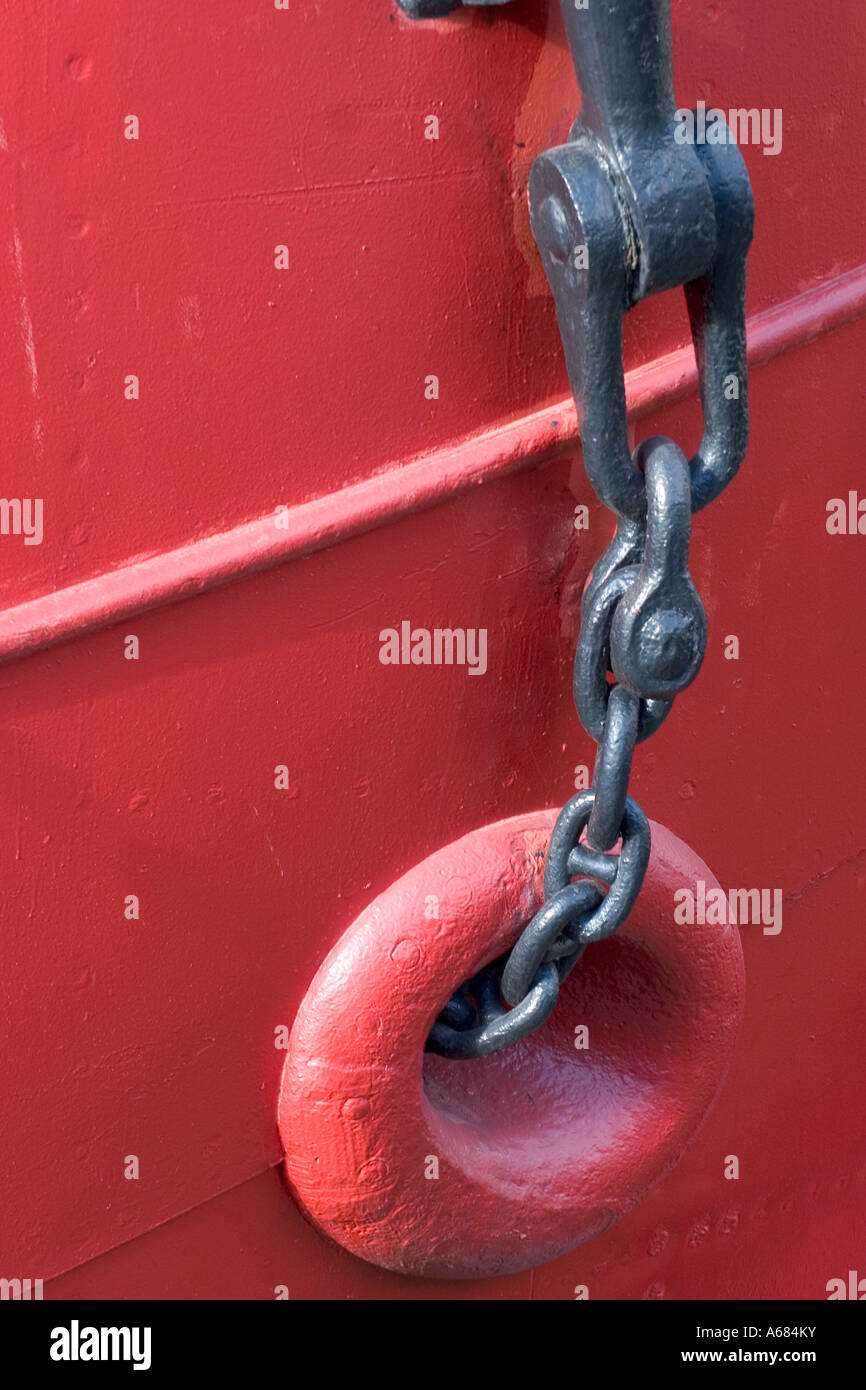 Close up of red hull and anchor chain on ship Stock Photo - Alamy