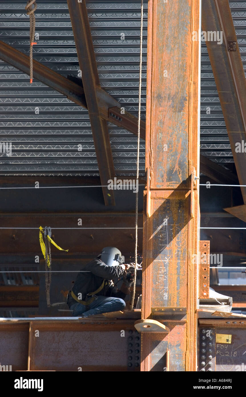 Man welding steel support on high rise building Stock Photo - Alamy