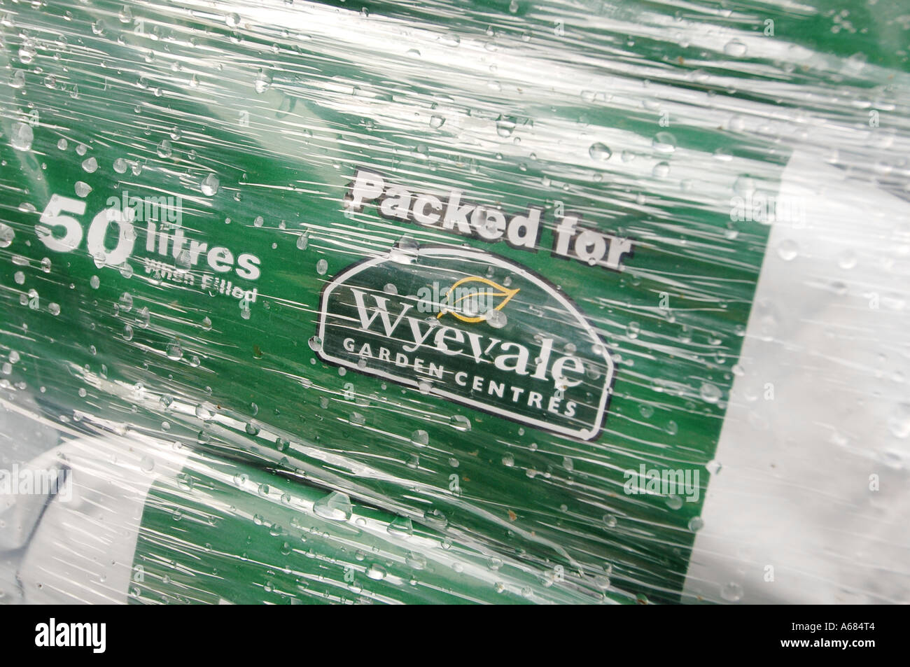 Condensation makes water droplets inside the plastic wrapping covering ...