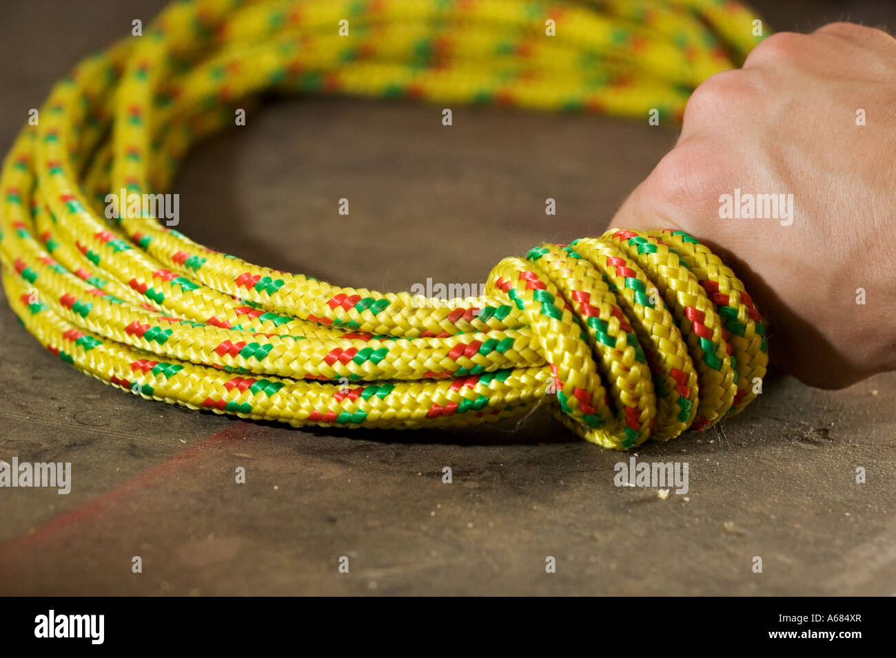 Close up of colorful rope and hand Stock Photo - Alamy