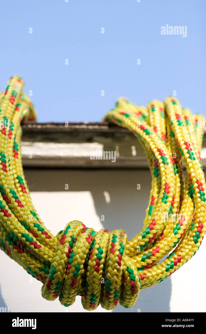 Yellow rope on edge of roof Stock Photo - Alamy