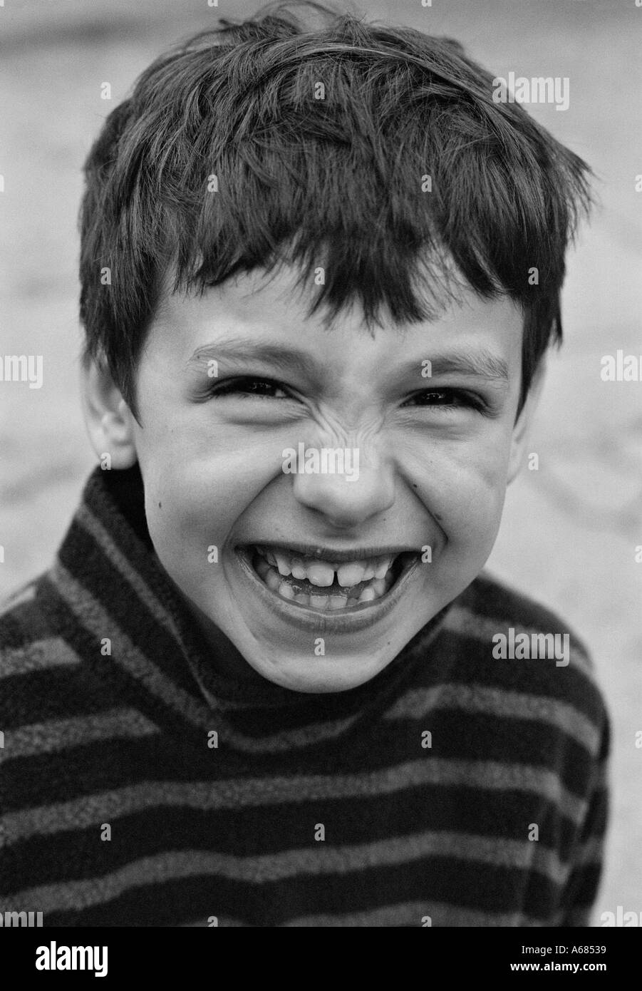 close crop portrait of boy laughing at camera Stock Photo - Alamy