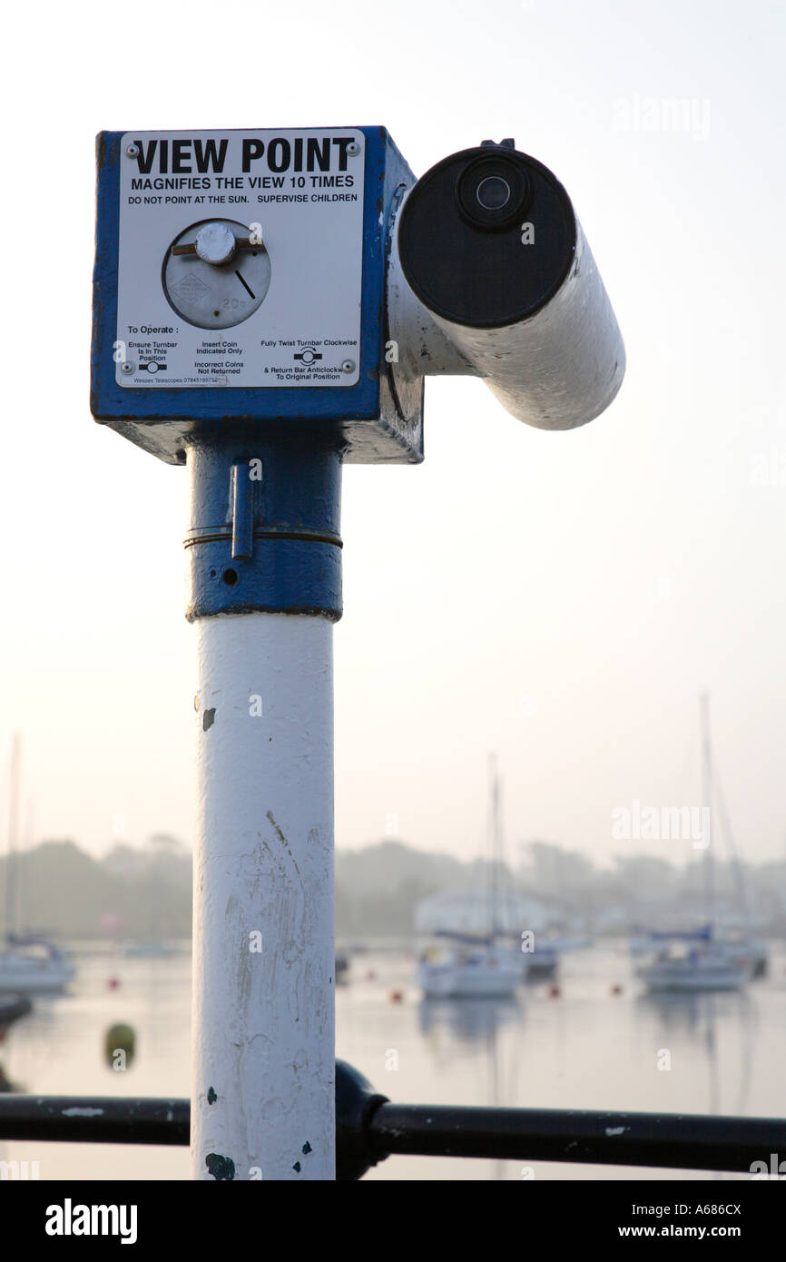 Public viewpoint telescope looking towards boats Stock Photo - Alamy