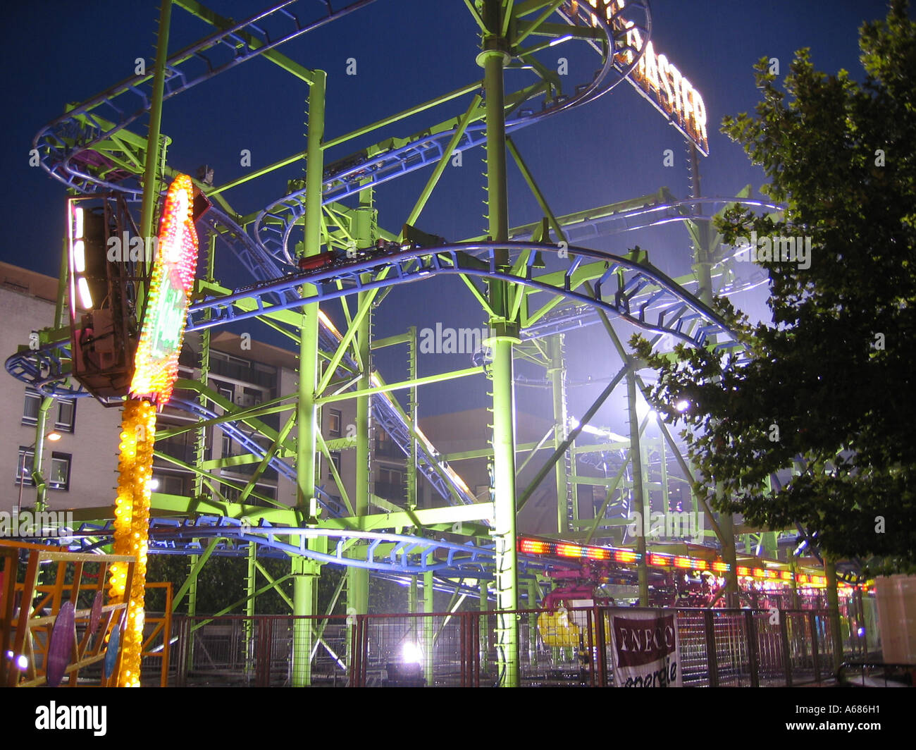 fairground roller coaster at dusk Stock Photo - Alamy