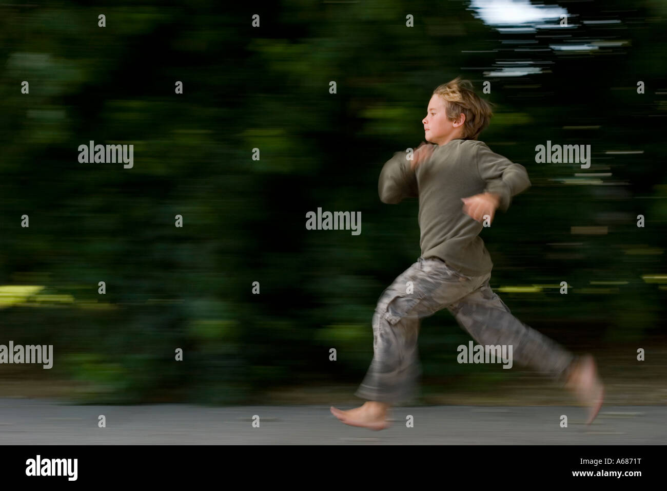 young, caucasian boy running Stock Photo - Alamy