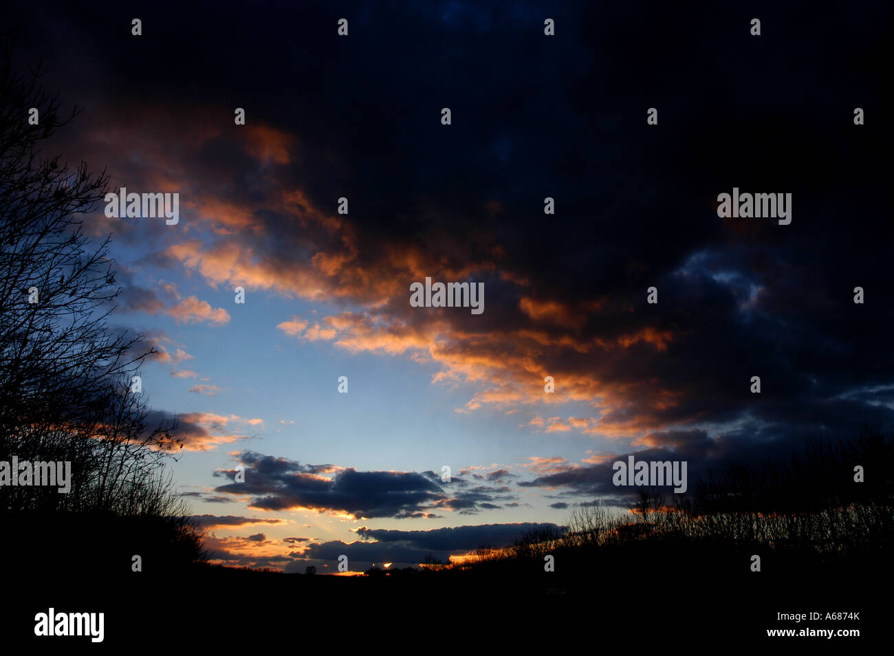 Dramatic patterns in the sky as the sun sets near Tiverton in Devon ...
