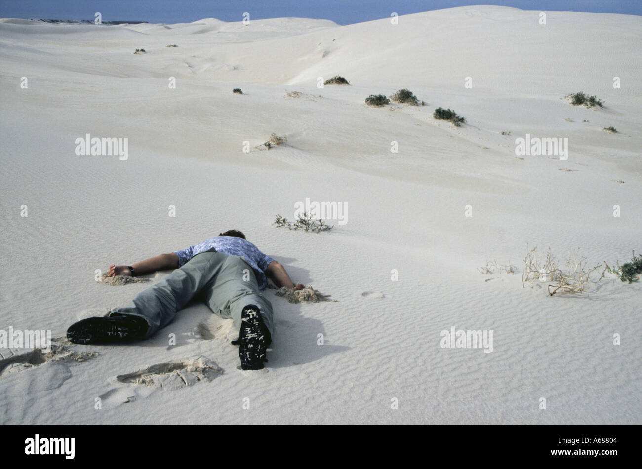 Man in desert Stock Photo - Alamy