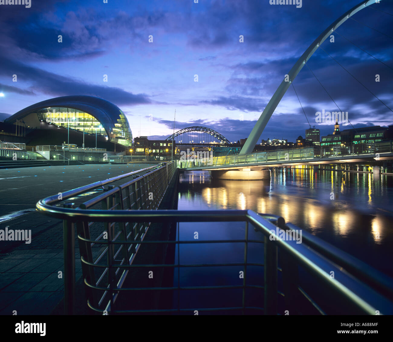 Sage Music Centre and Millenium Bridge reflect in River Tyne at night ...