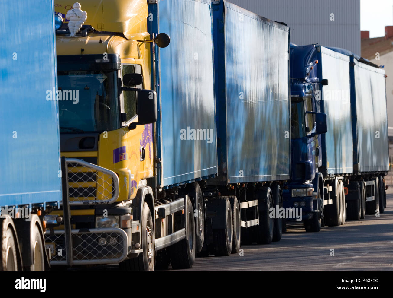 Trucks parked tightly behind the trailer of another truck , Finland ...