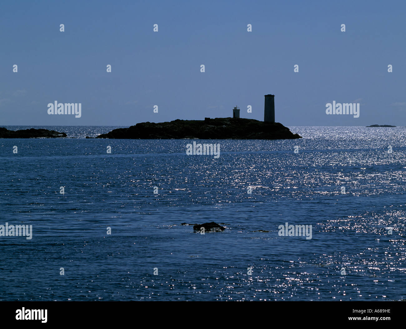 large atlantic rock with lighthouse for mariners Stock Photo - Alamy