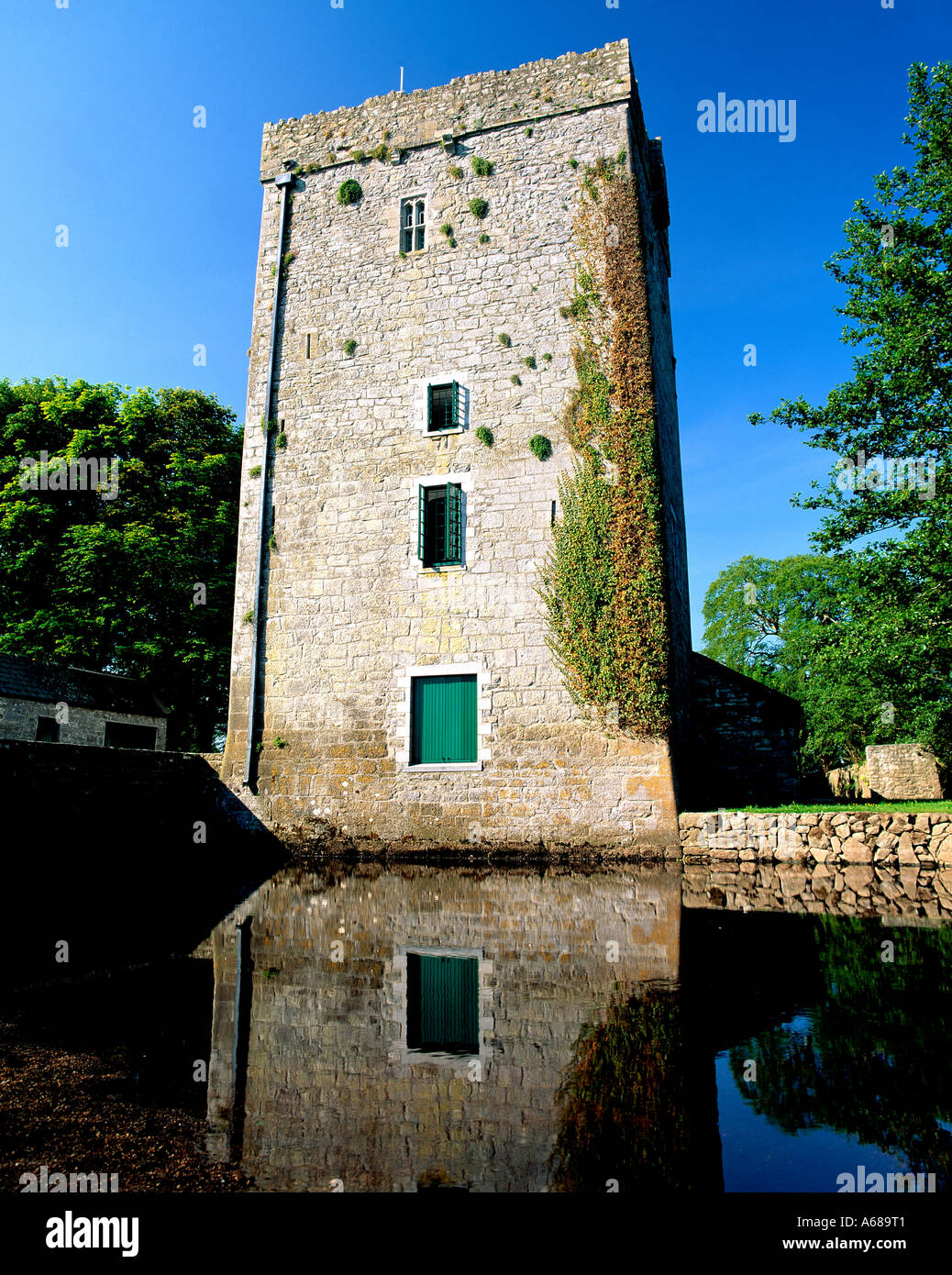 large four sided castle on a river bank former place of living of a ...
